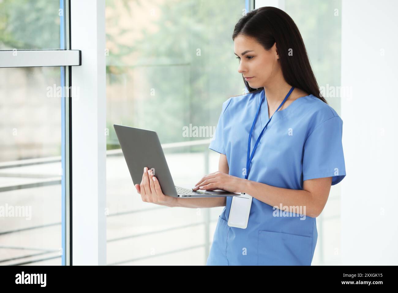 Beautiful nurse working with laptop in hospital office Stock Photo - Alamy