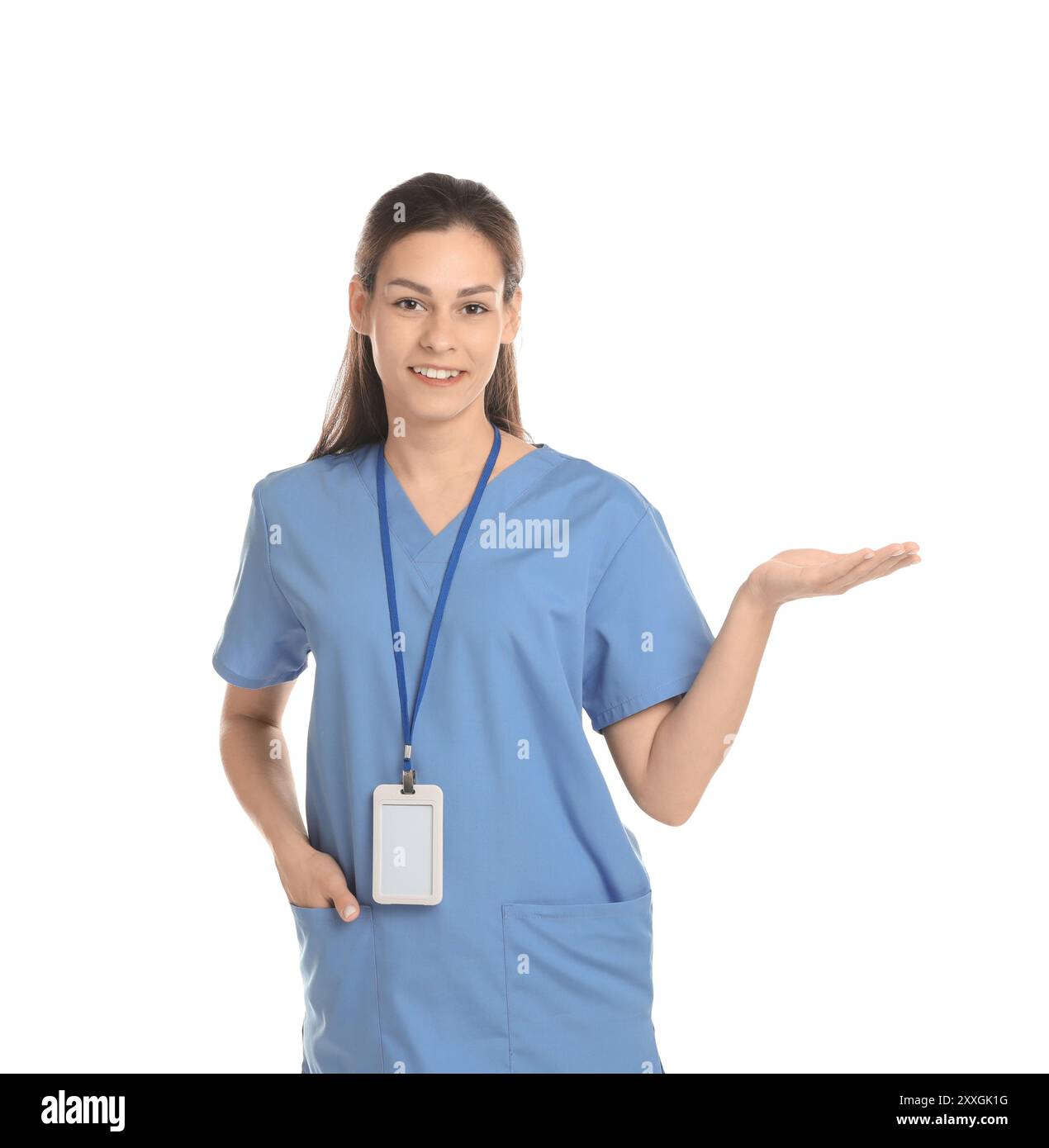Smiling nurse holding something on white background Stock Photo - Alamy