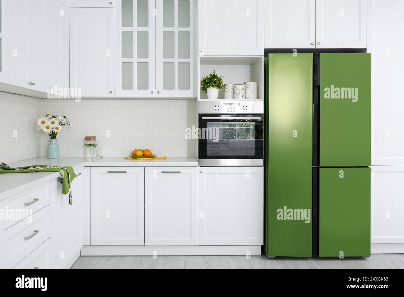 Green refrigerator in kitchen. Bright color accent in interior Stock ...