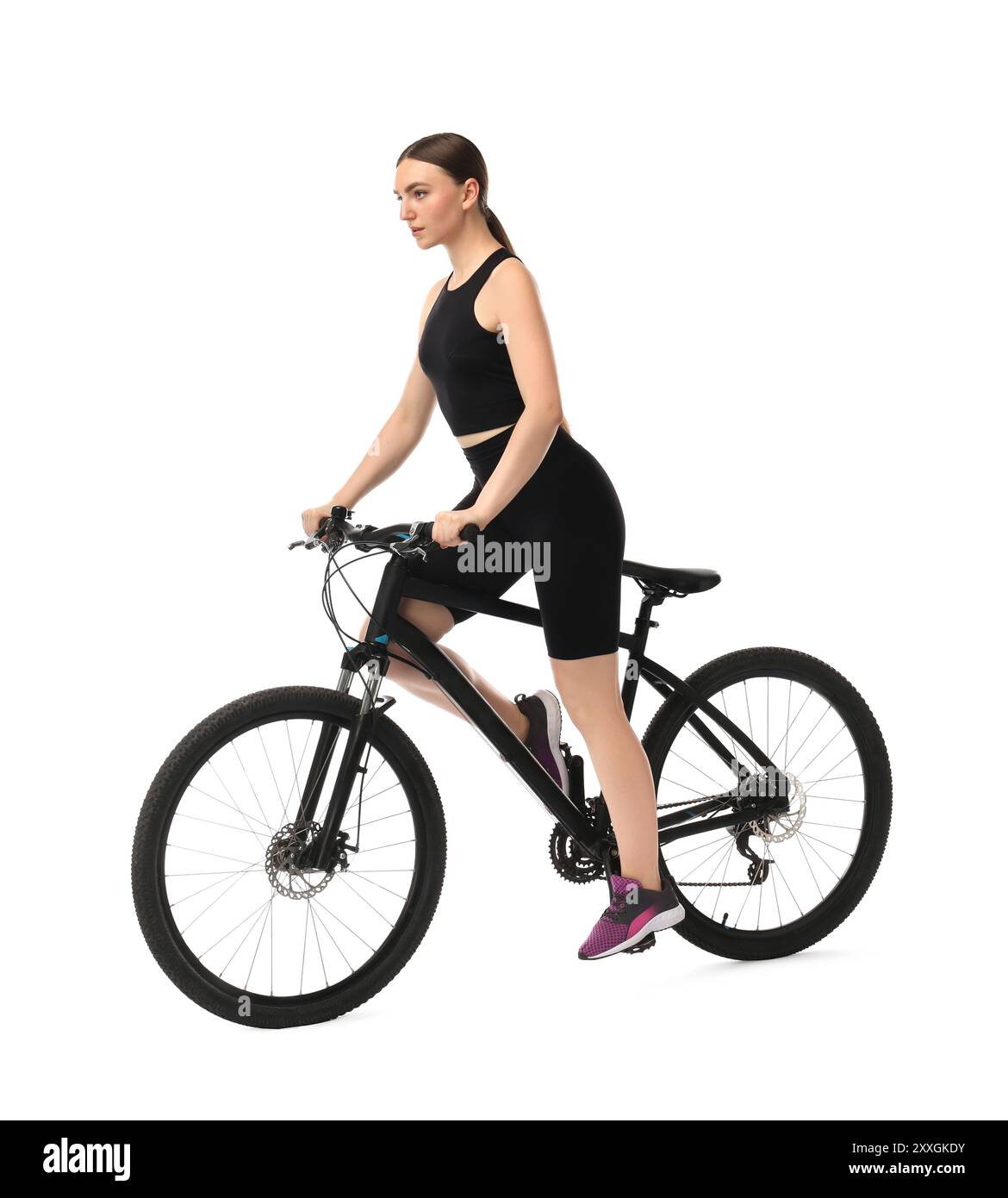 Beautiful young woman riding bicycle on white background Stock Photo ...