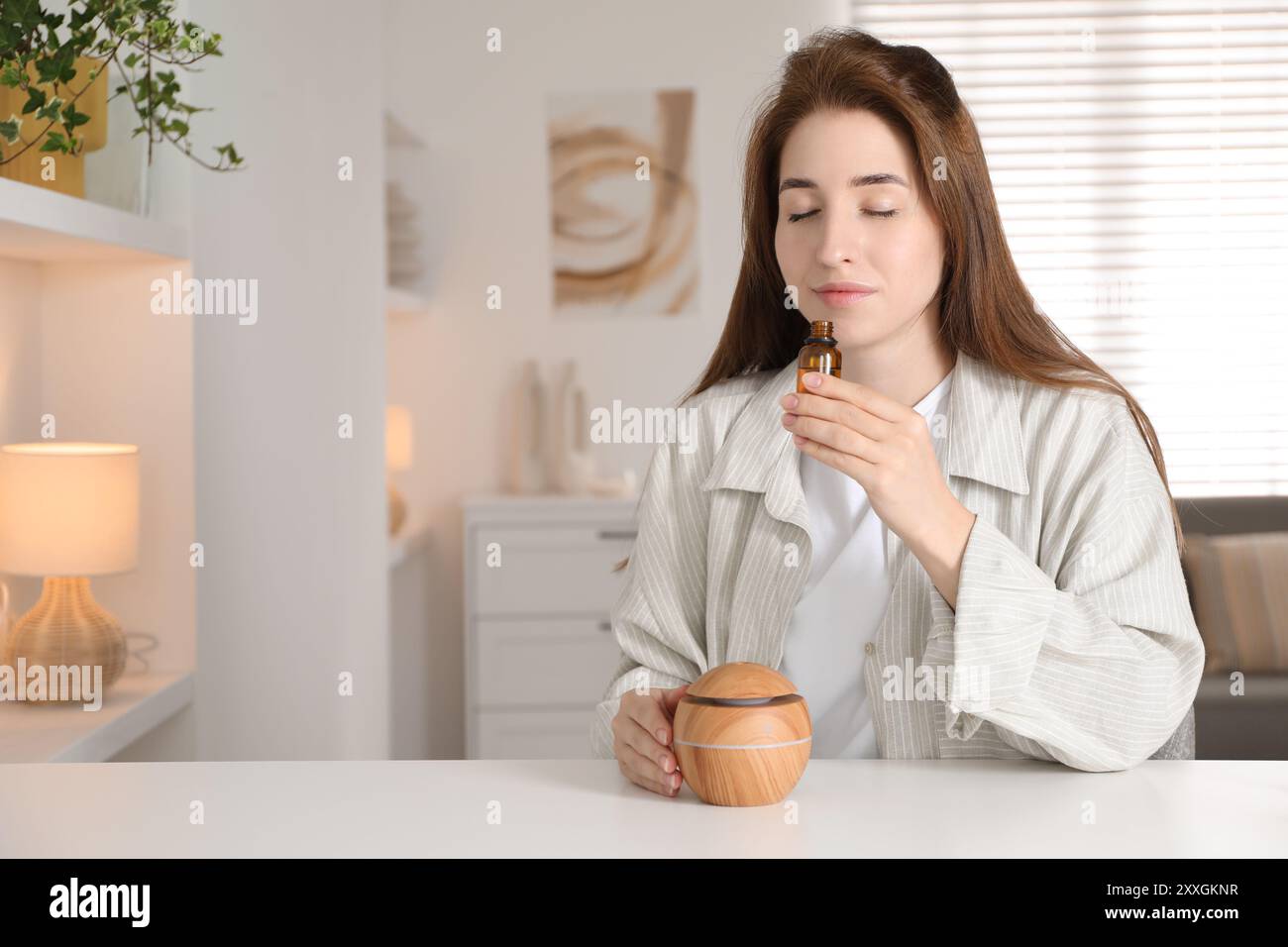 Beautiful woman smelling essential hi-res stock photography and images ...