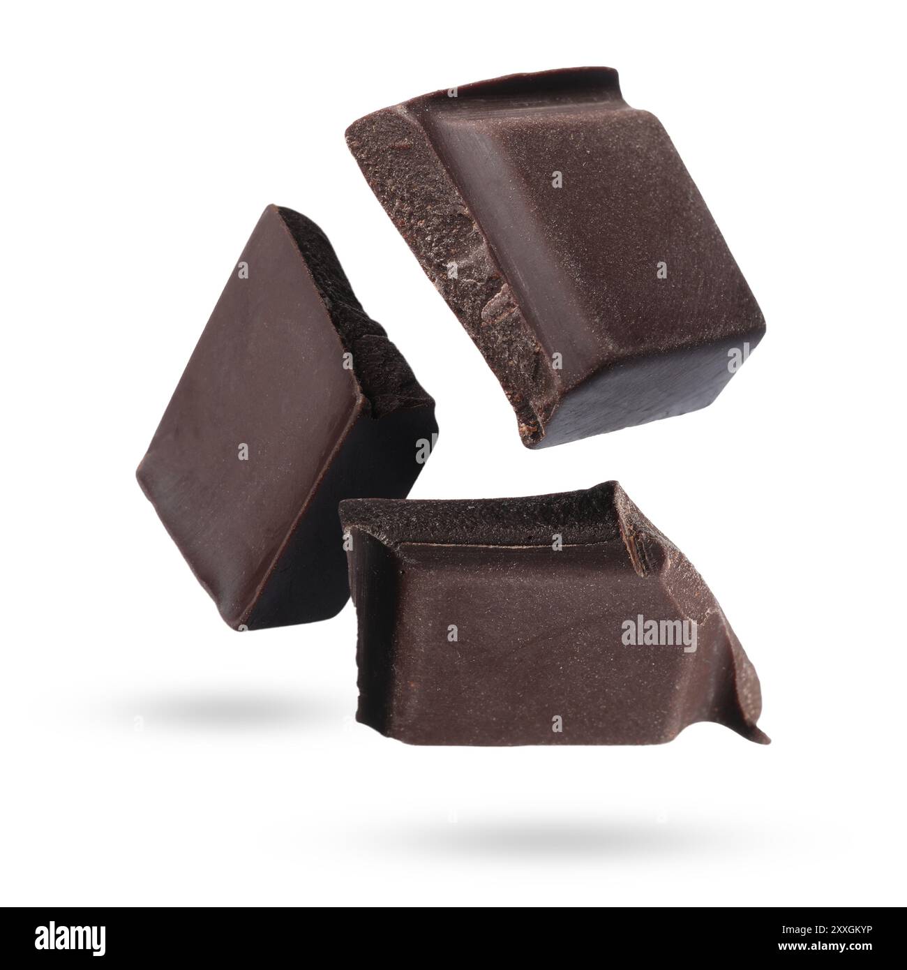 Pieces of sweet chocolate falling on white background Stock Photo - Alamy