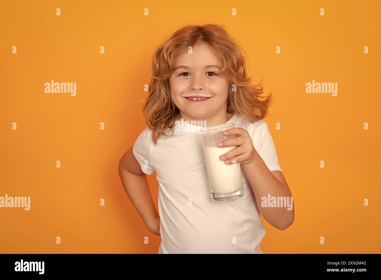 Kid drink milk with funny emotions on yellow background. Child drinking ...