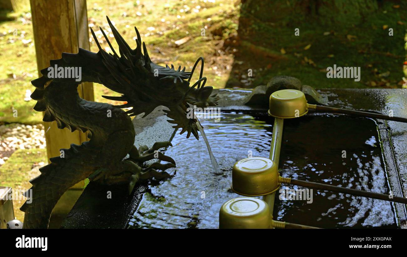 Dragon water spout placed in a Japanese garden Stock Photo - Alamy