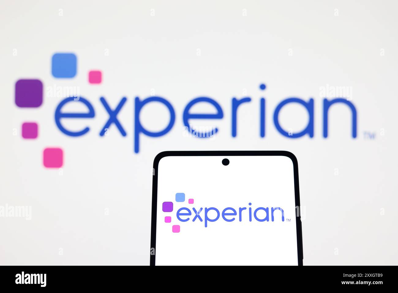 In this photo illustration, the Experian plc logo is displayed on a ...
