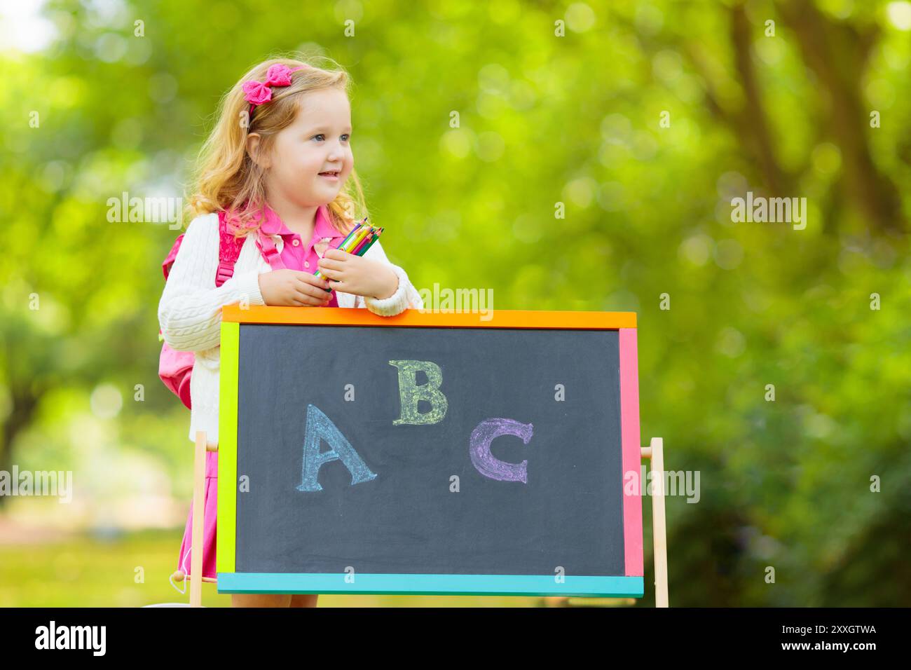 Children happy to be back to school. Preschooler girl and boy with ...