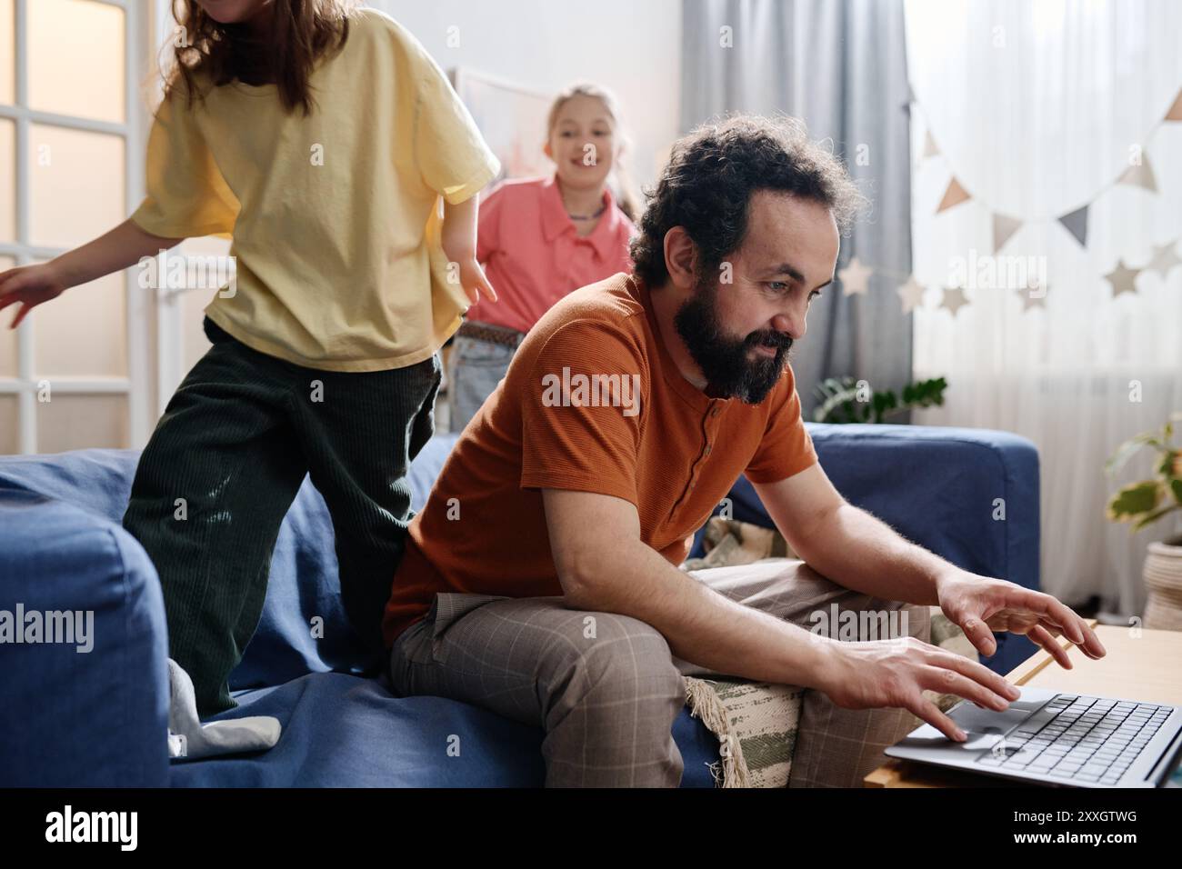 Father spending time with daughters engaging in online activities on ...