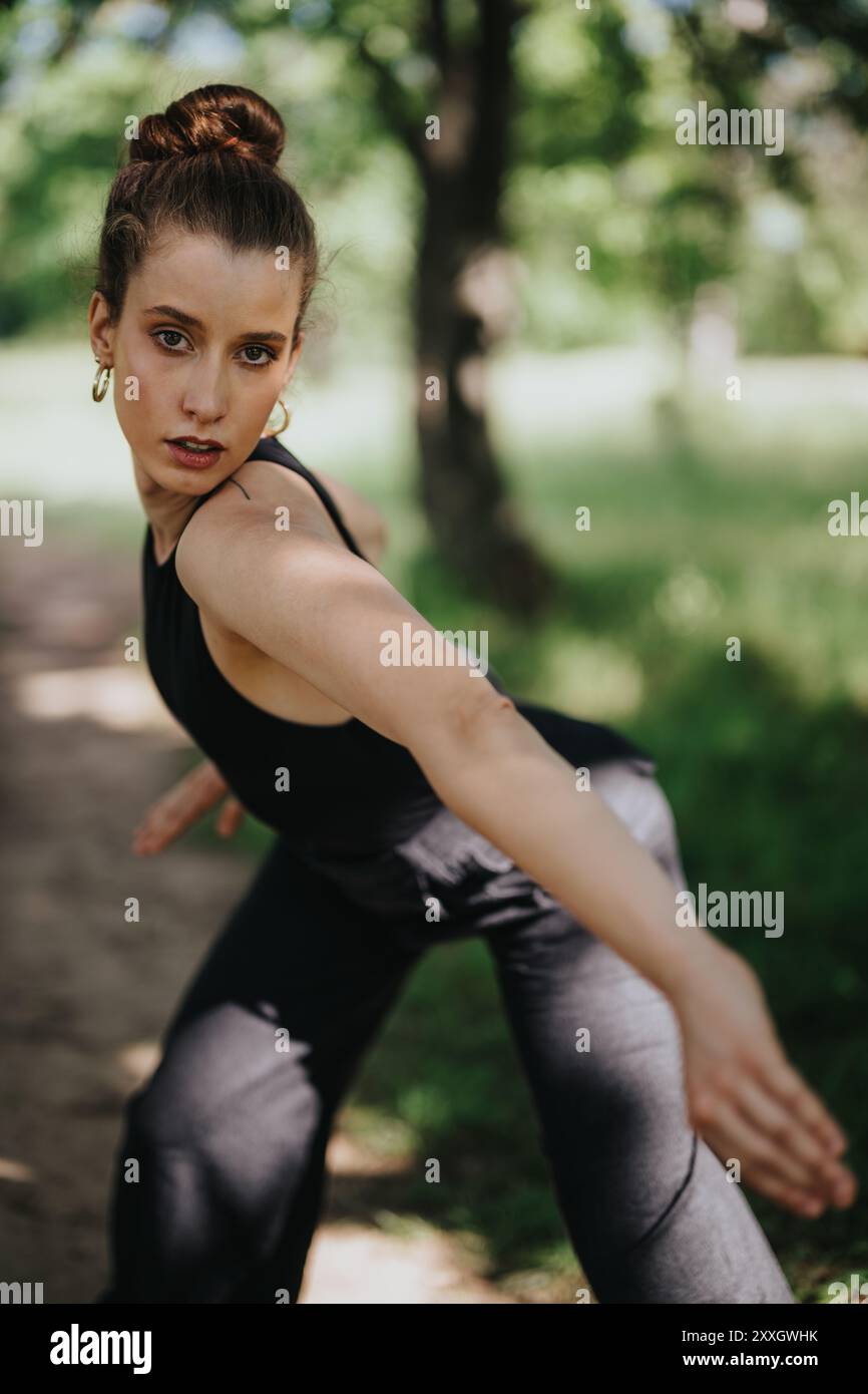 Lovely girl dancing in nature, featuring a female dancer performing modern dance in an outdoor ...