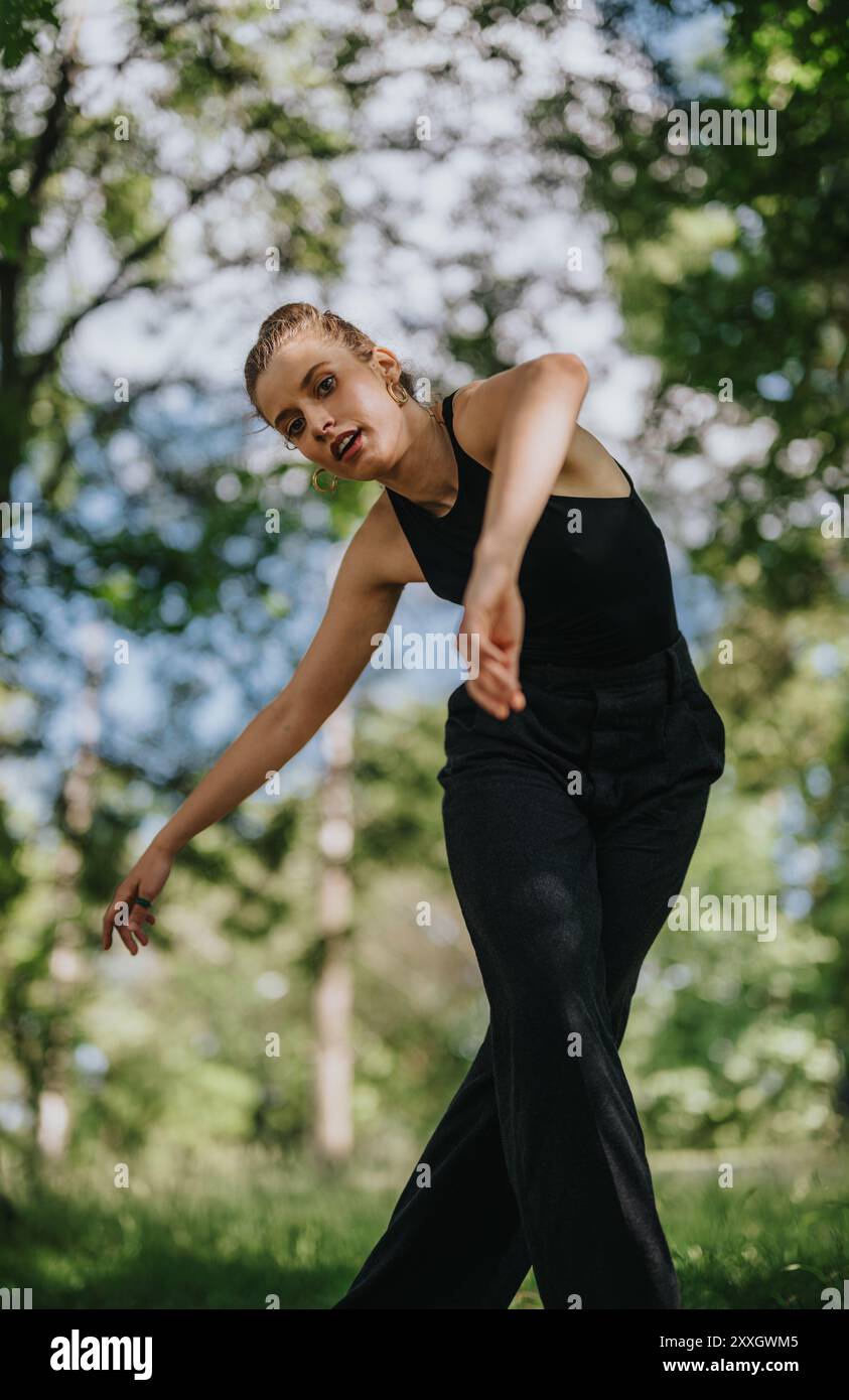 Lovely girl dancing outdoors, female dancer performing modern dance in nature Stock Photo - Alamy