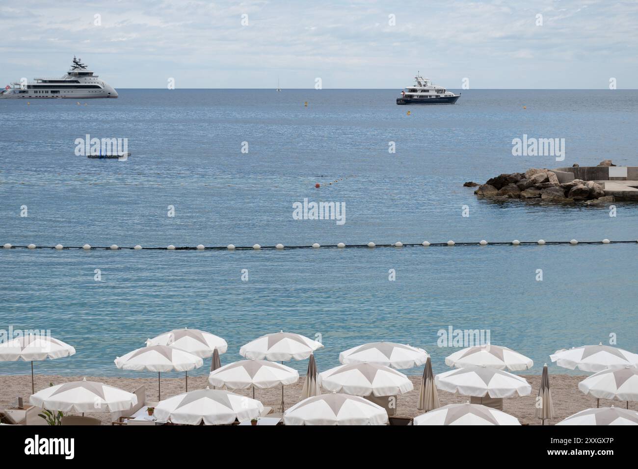 Sandy beach in Monaco, Monte-Carlo Lavrotto beach with clear sea water ...