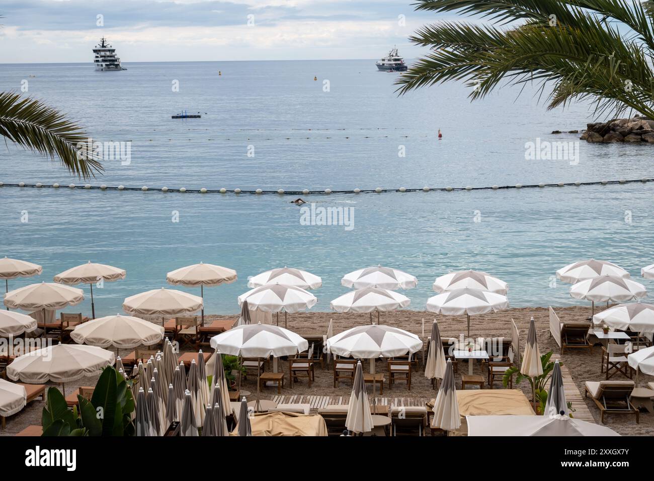 Sandy beach in Monaco, Monte-Carlo Lavrotto beach with clear sea water ...