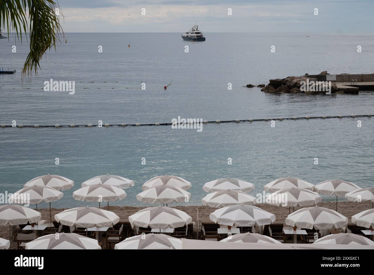 Sandy beach in Monaco, Monte-Carlo Lavrotto beach with clear sea water ...