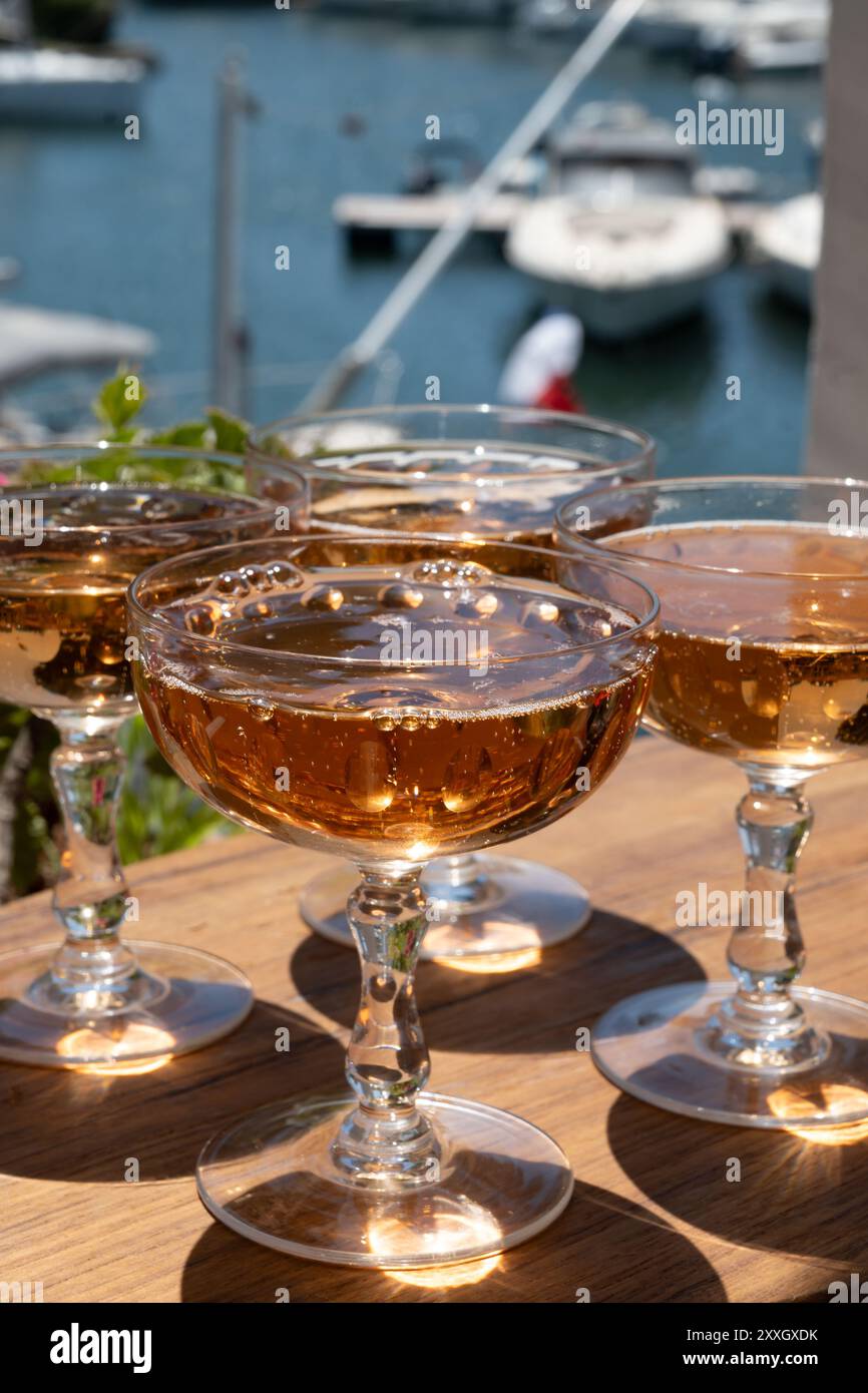French brut rose champagne sparkling wine in coupe glasses in yacht ...
