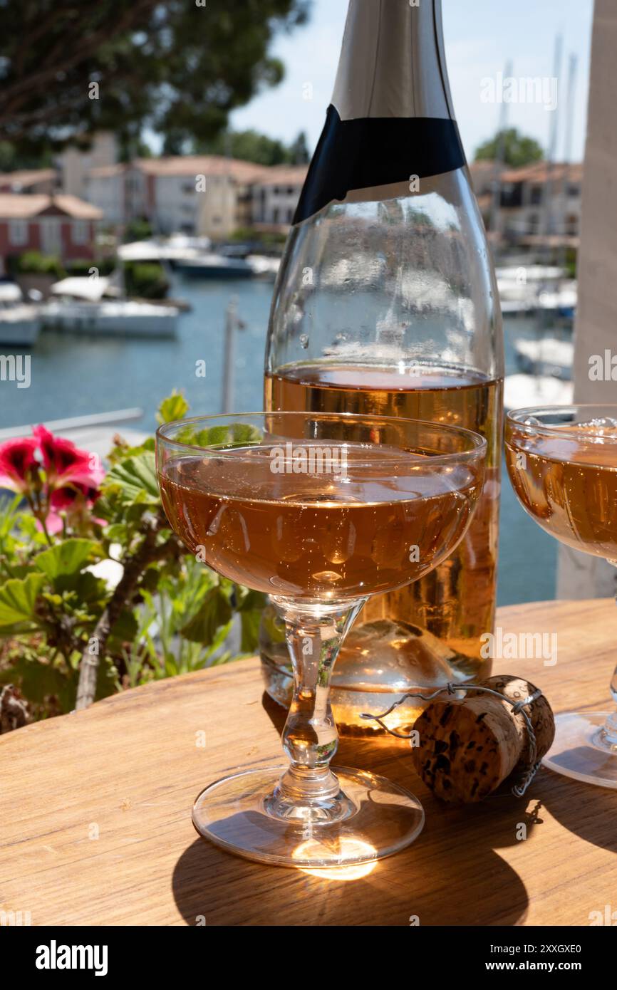 French brut rose champagne sparkling wine in coupe glasses in yacht ...