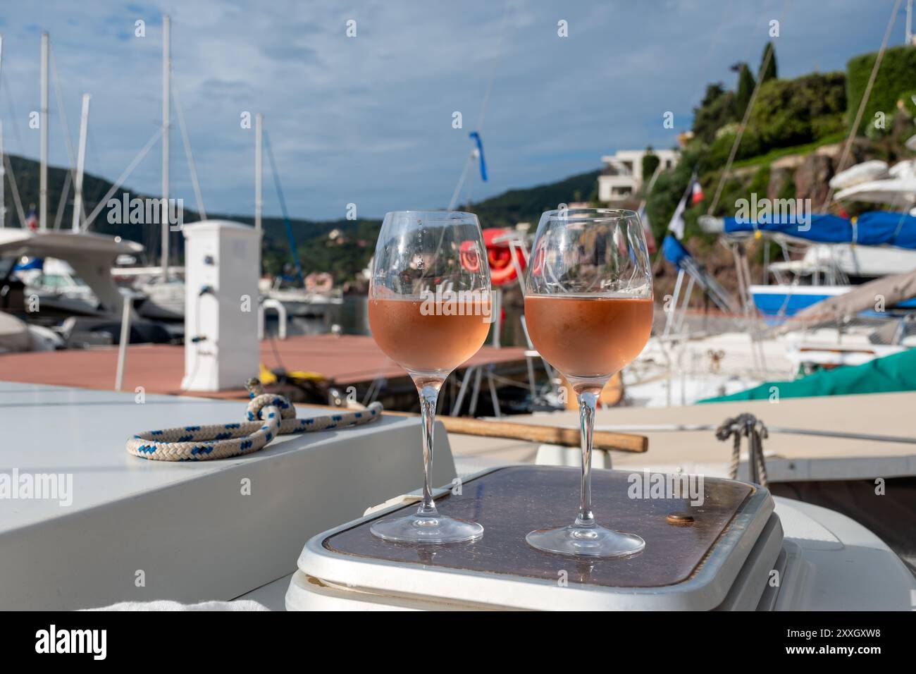 Party with cold rose wine on yacht boat anchored in port la Rague, Gulf ...