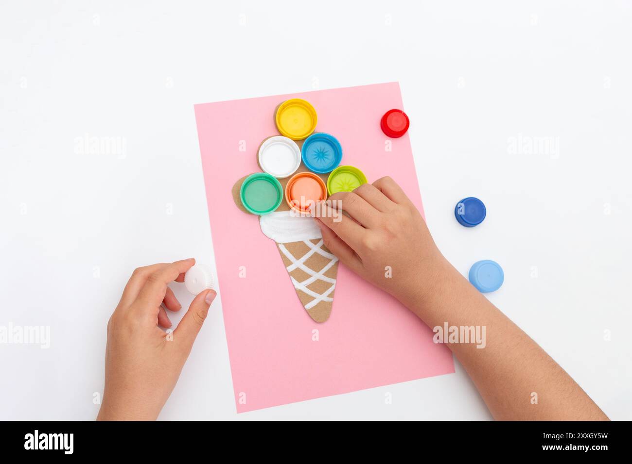Ice cream cone craft on pink background, pastel process art, children ...