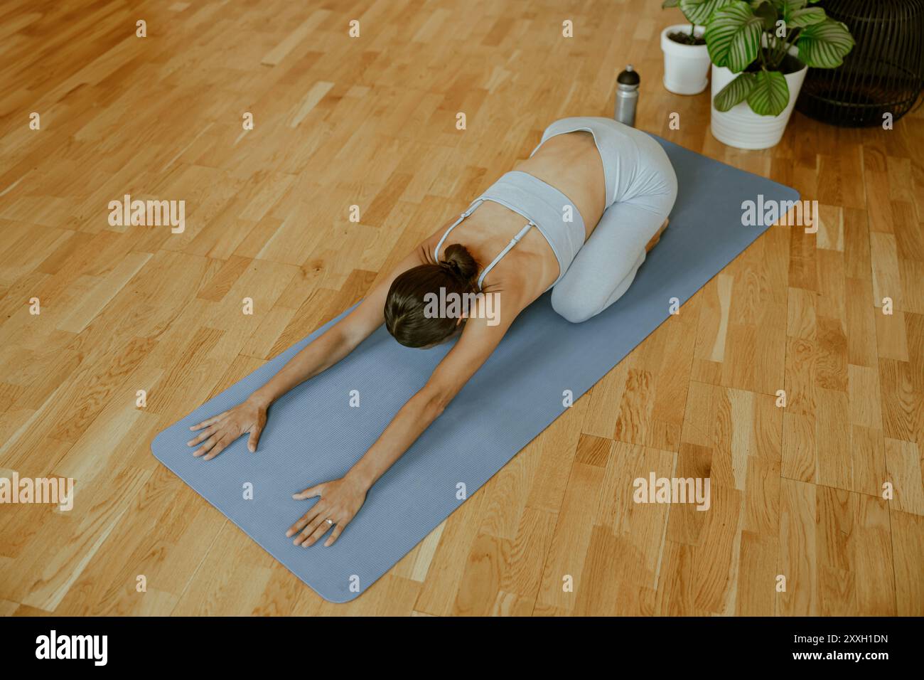 Engaging in a relaxing yoga pose promotes mindfulness and enhances ...