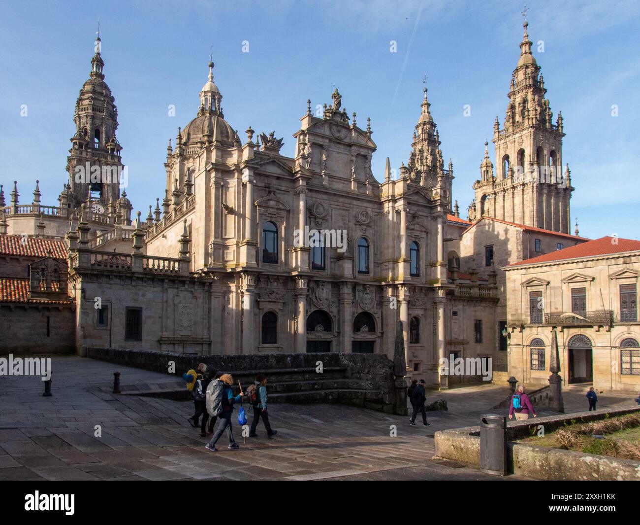 Early morning pilgrims entering the Santiago and taking the last steps ...