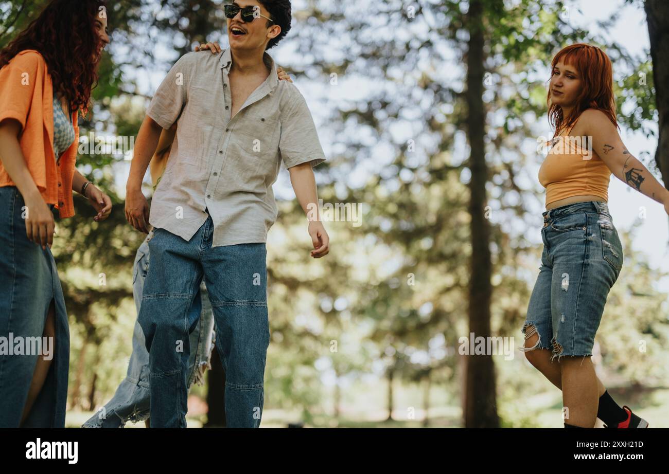 Young teenagers having fun in the park showcasing friendship, joy and ...
