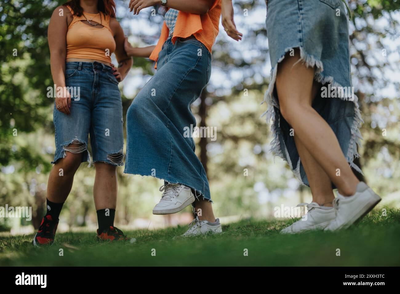 Young teenagers having fun in the park showcasing friendship, joy, and ...