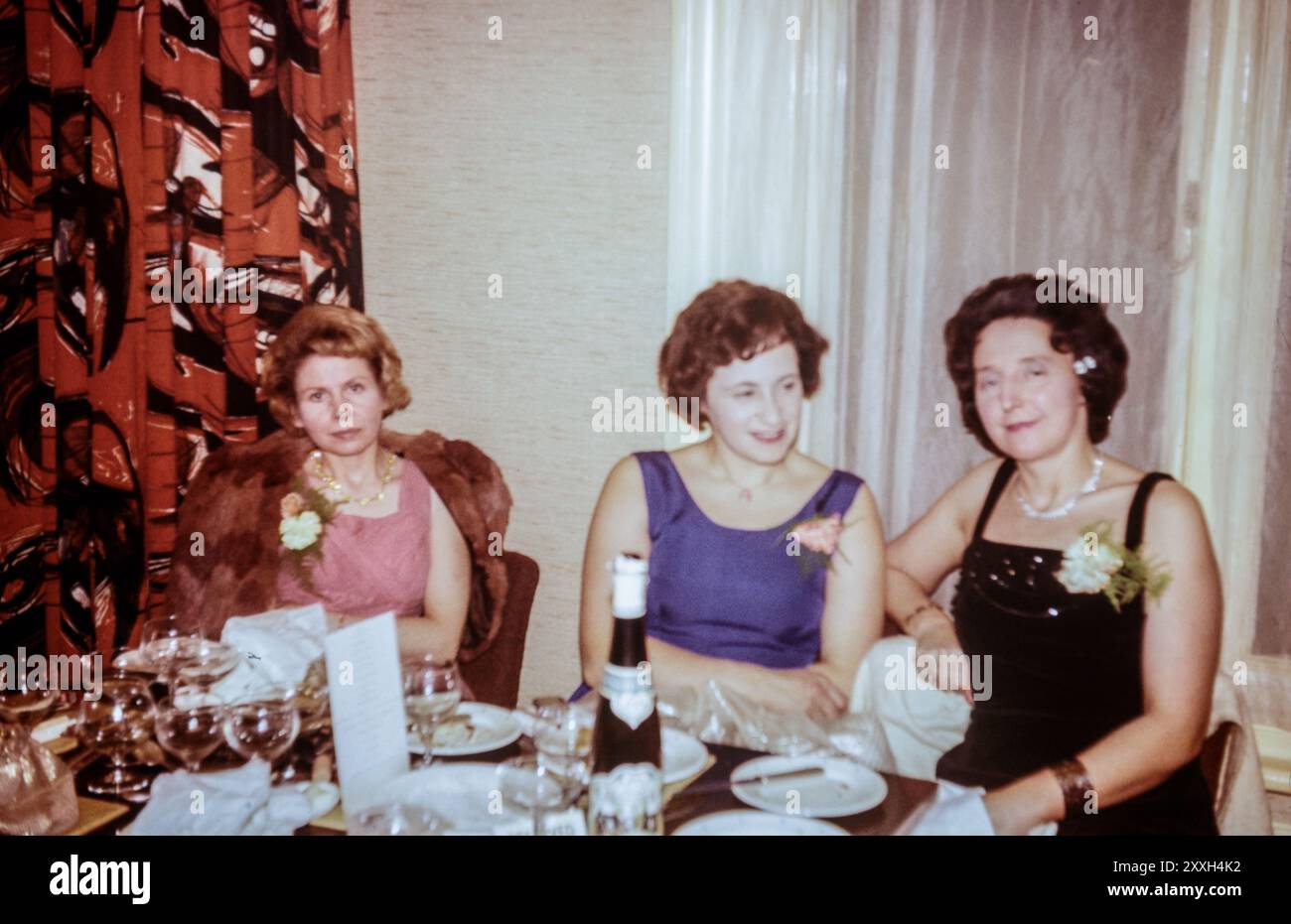 Friends sit drinking at a wedding reception in the 60s Stock Photo - Alamy