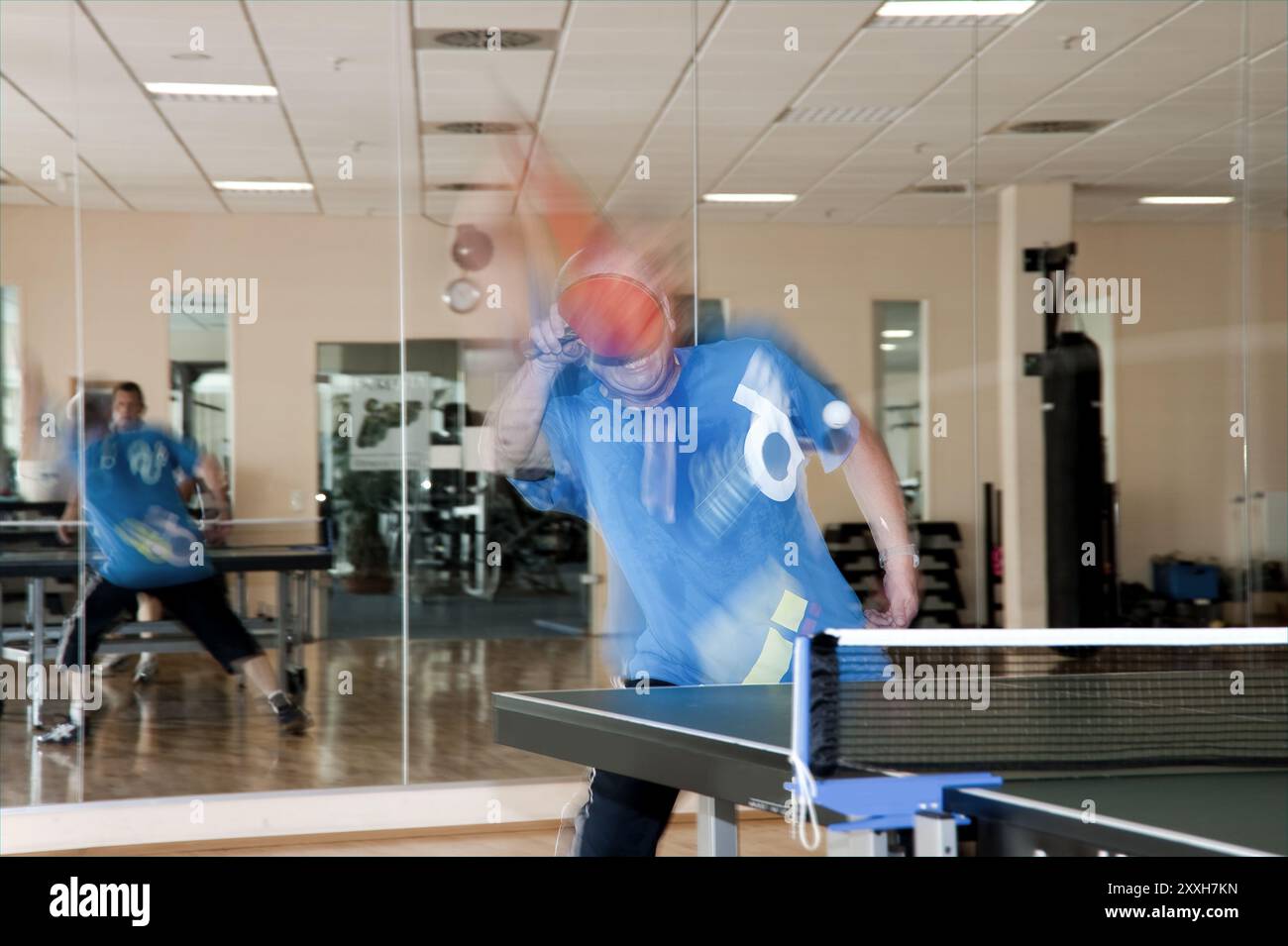 Table tennis player hitting with the forehand Stock Photo - Alamy