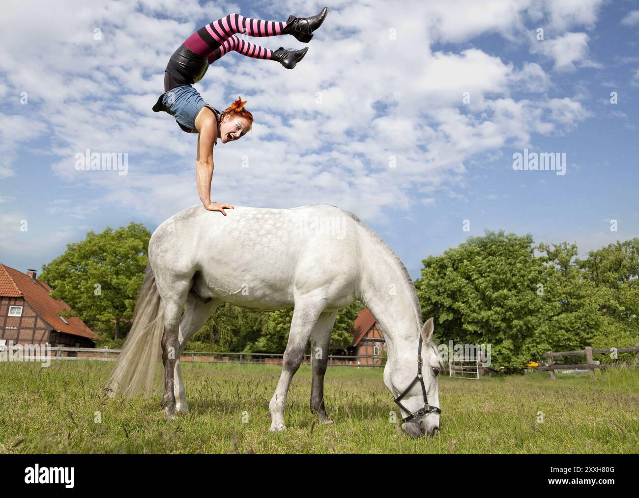 Pippi Longstocking does a handstand on little uncle Stock Photo - Alamy
