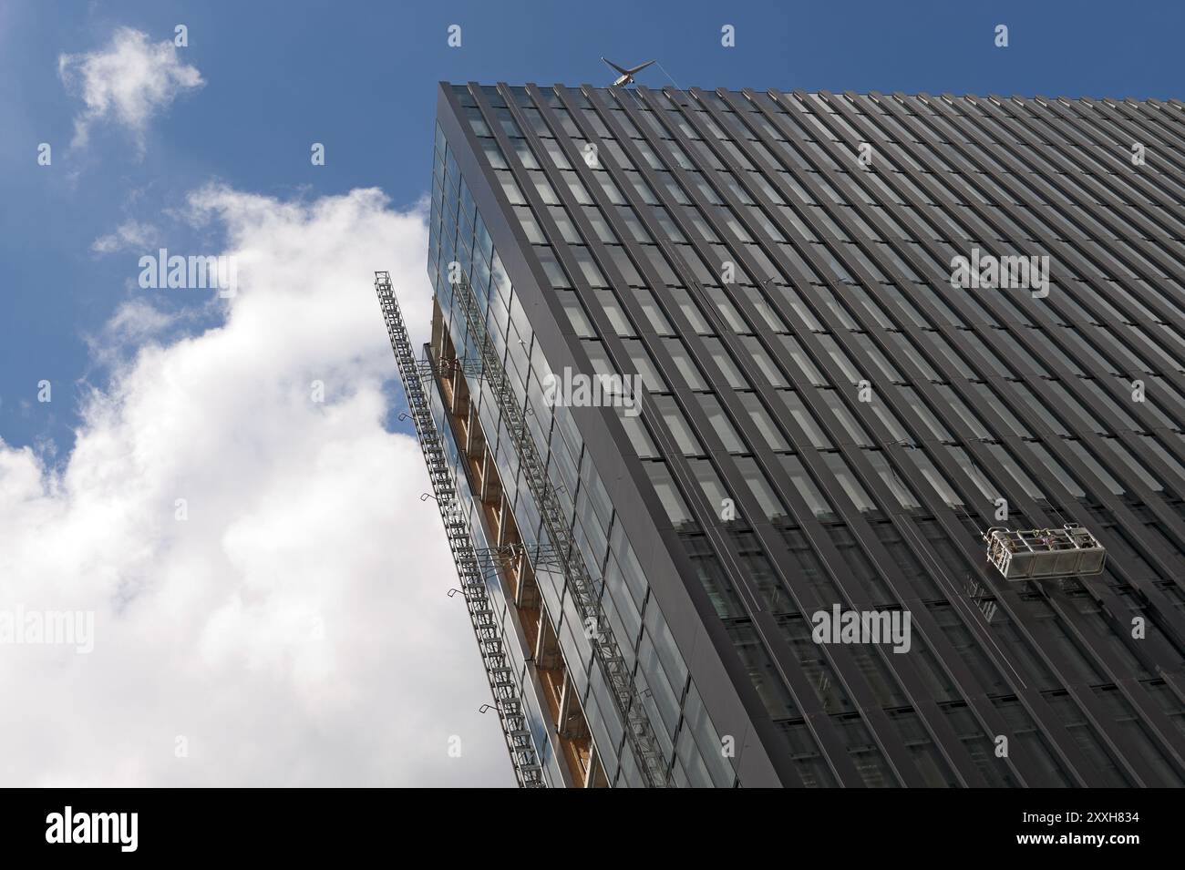 Window cleaner on the facade of a tower block Stock Photo - Alamy