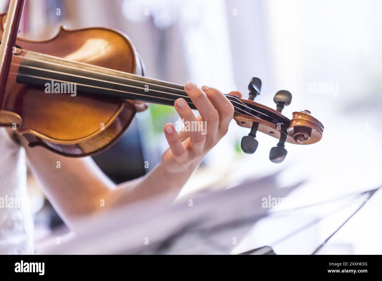 Pretty young girl practices on her violin, acoustic music Stock Photo ...