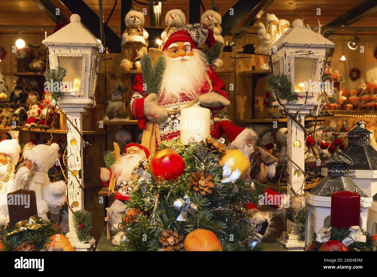 Christmas market stall with Santa Claus figurine and christmas tree ...