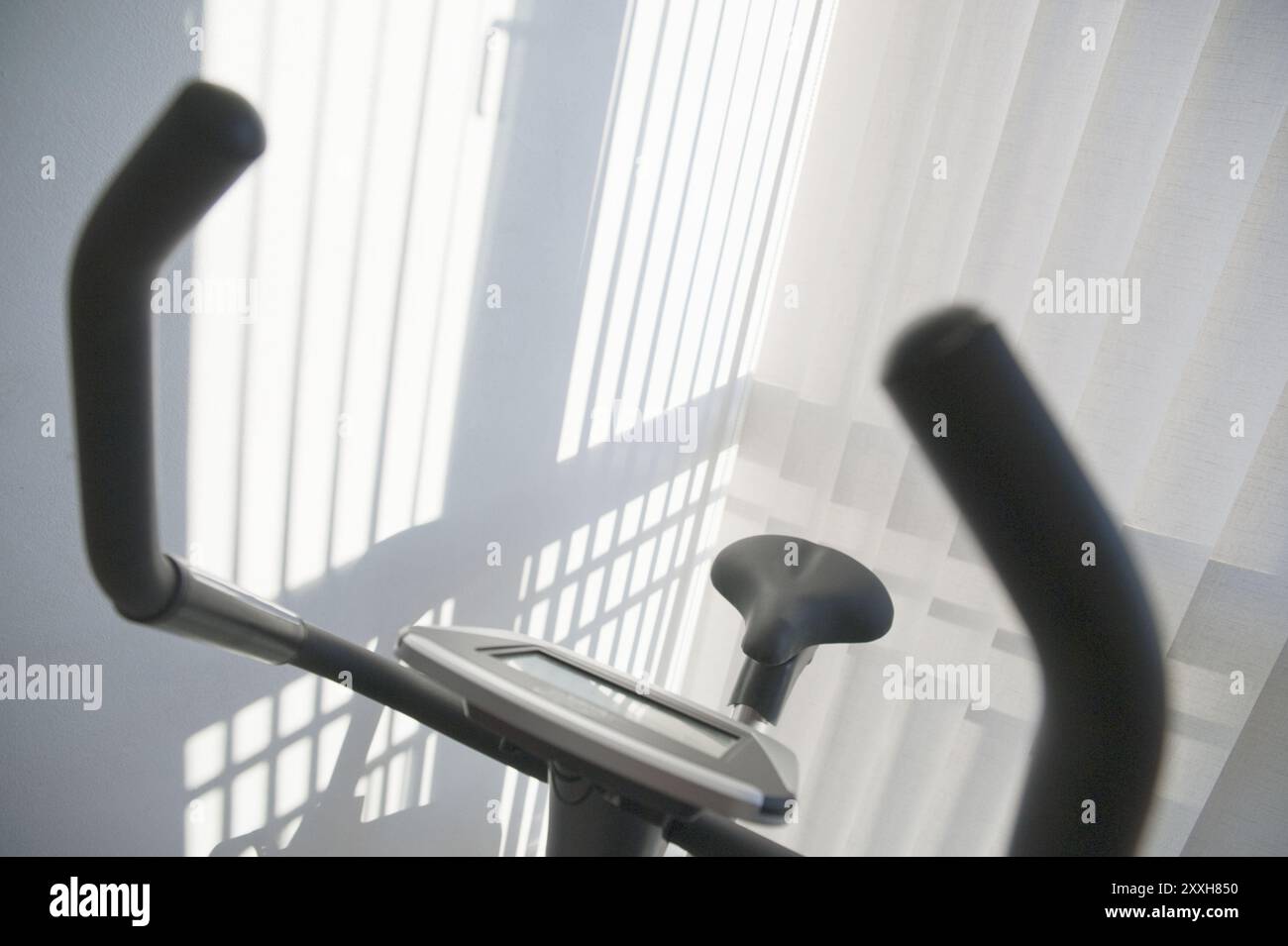 Cycle ergometer in a sunny corner of the room Stock Photo - Alamy