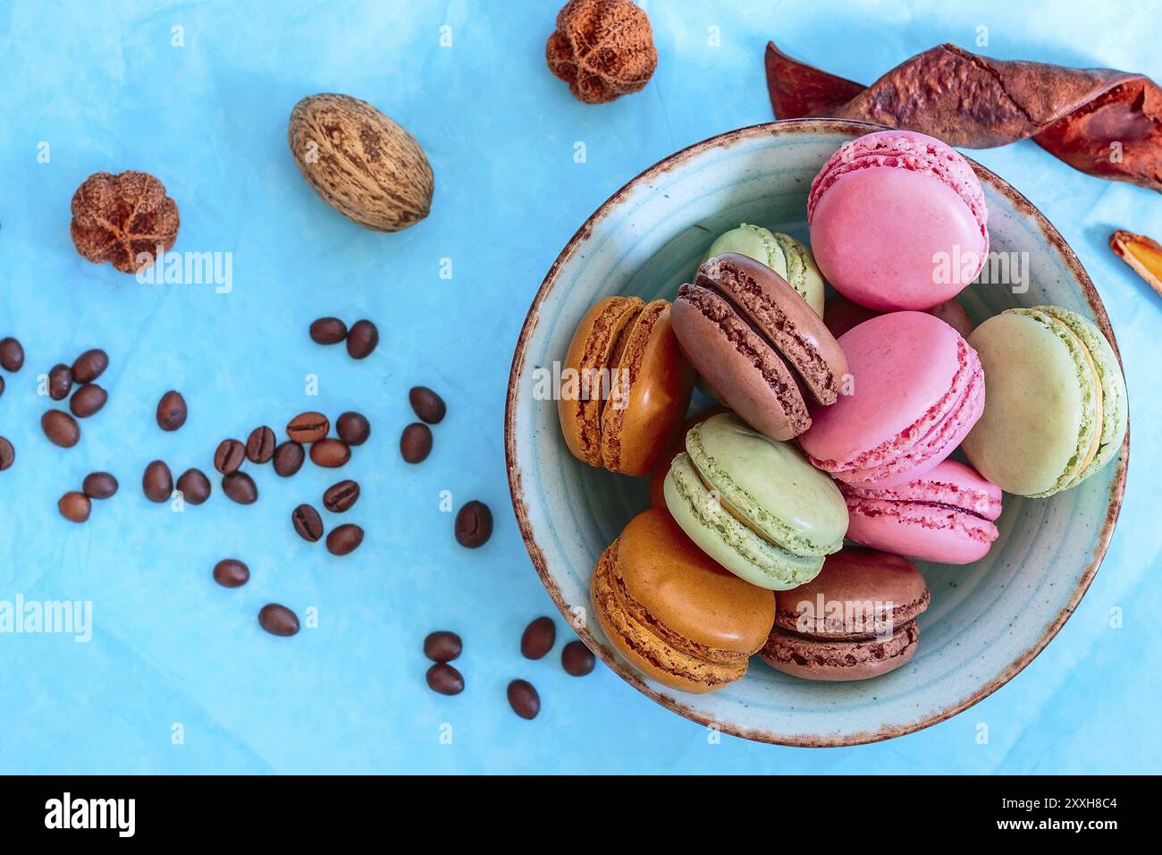 Cake macaron or macaroon bowl on turquoise blue background, coffee ...