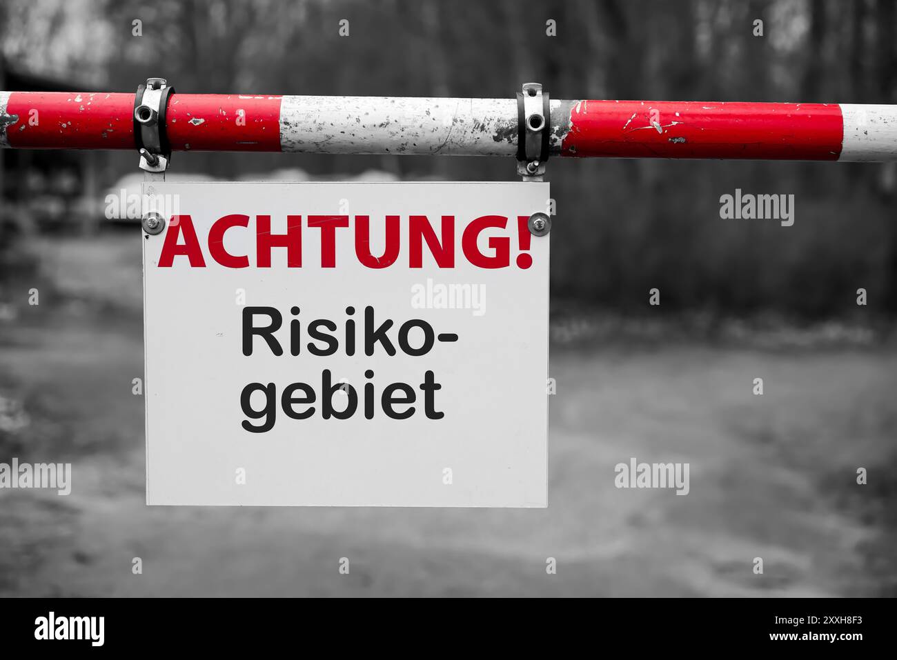 Sign with the inscription risk area. Due to many new corona infections ...