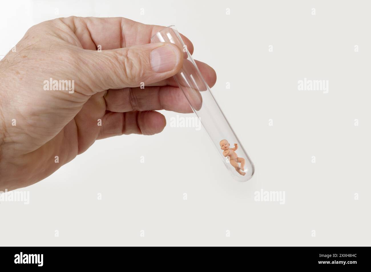 Baby in a test tube Stock Photo - Alamy