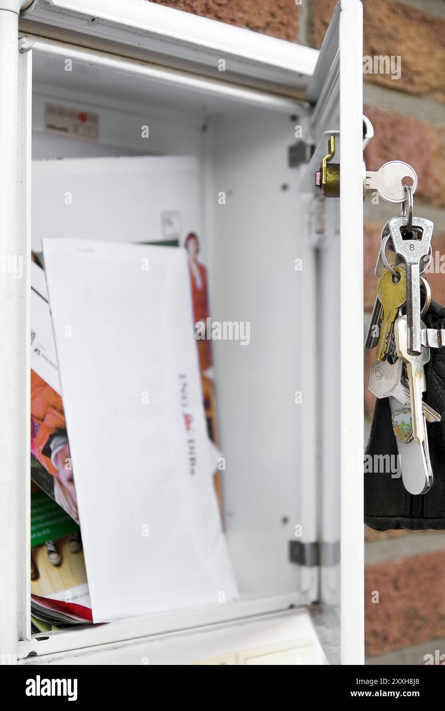 Open letterbox with key ring Stock Photo - Alamy