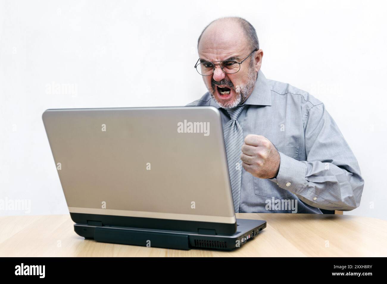 Man with a tantrum on his laptop Stock Photo - Alamy