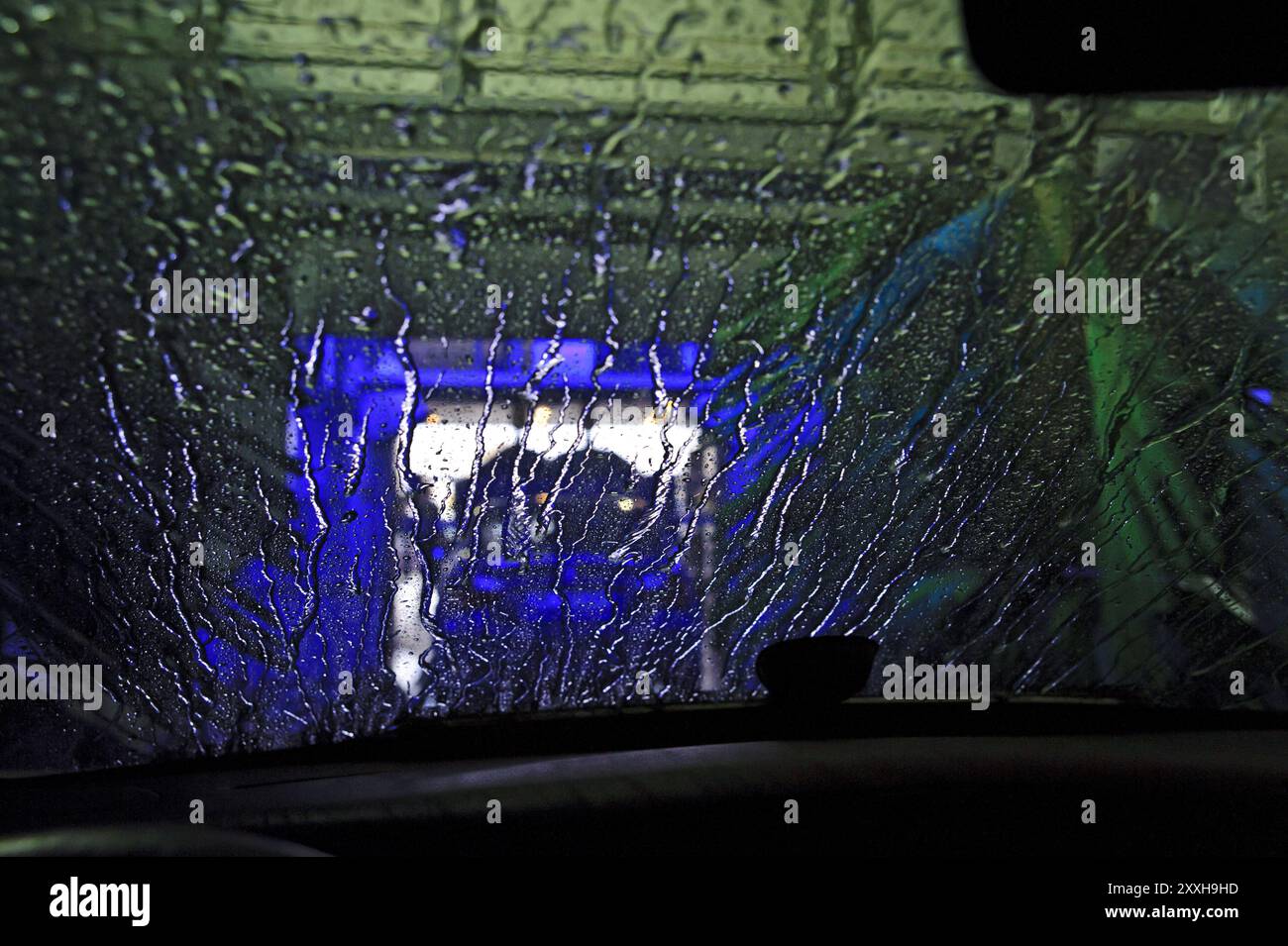 Traces of water on the windscreen of a car in a car wash Stock Photo ...