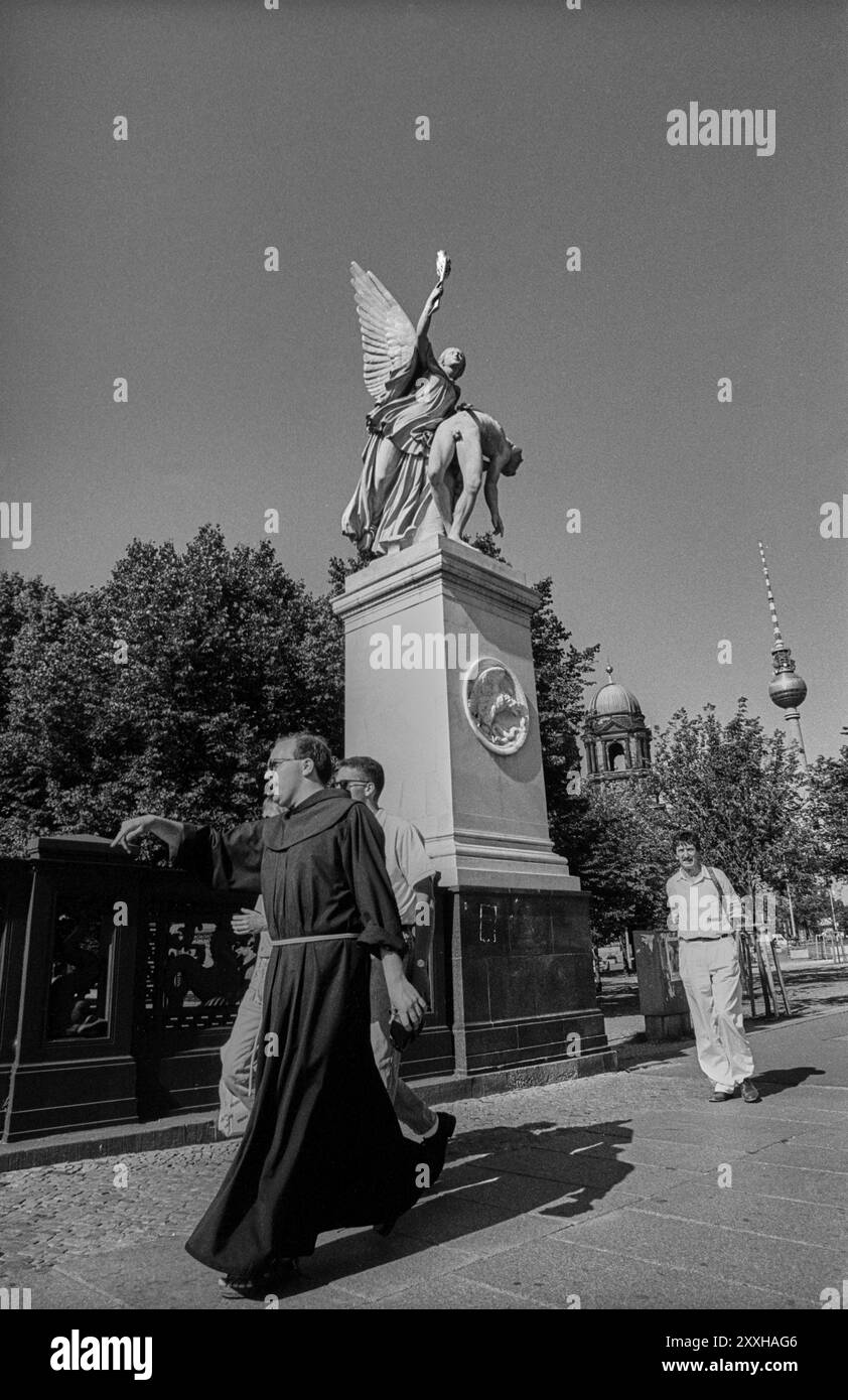 Germany, Berlin, 1 July 1991, Priest on the castle bridge, figure: Iris ...