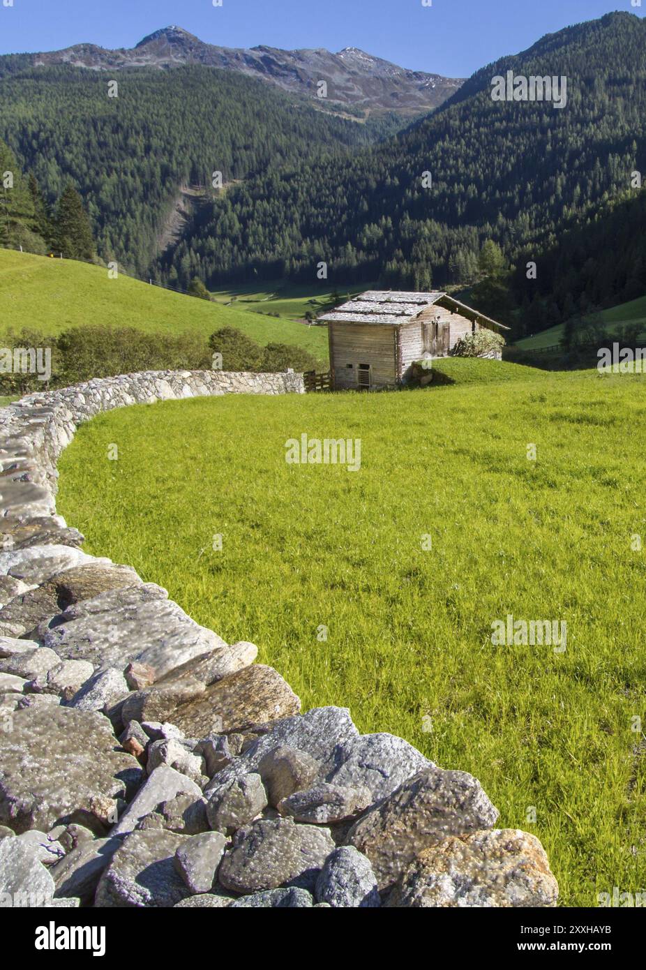 South Tyrolean mountain idyll with alpine hut and wall Stock Photo - Alamy