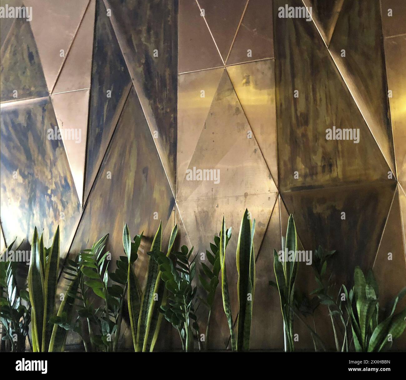 Textured background of shabby metal wall with geometric panels in shape ...