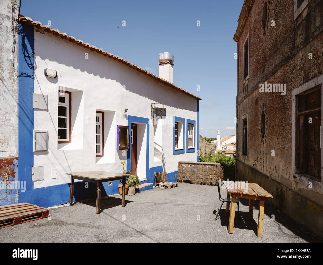 Cute house painted in white and blue in the alleys of Castro Verde ...