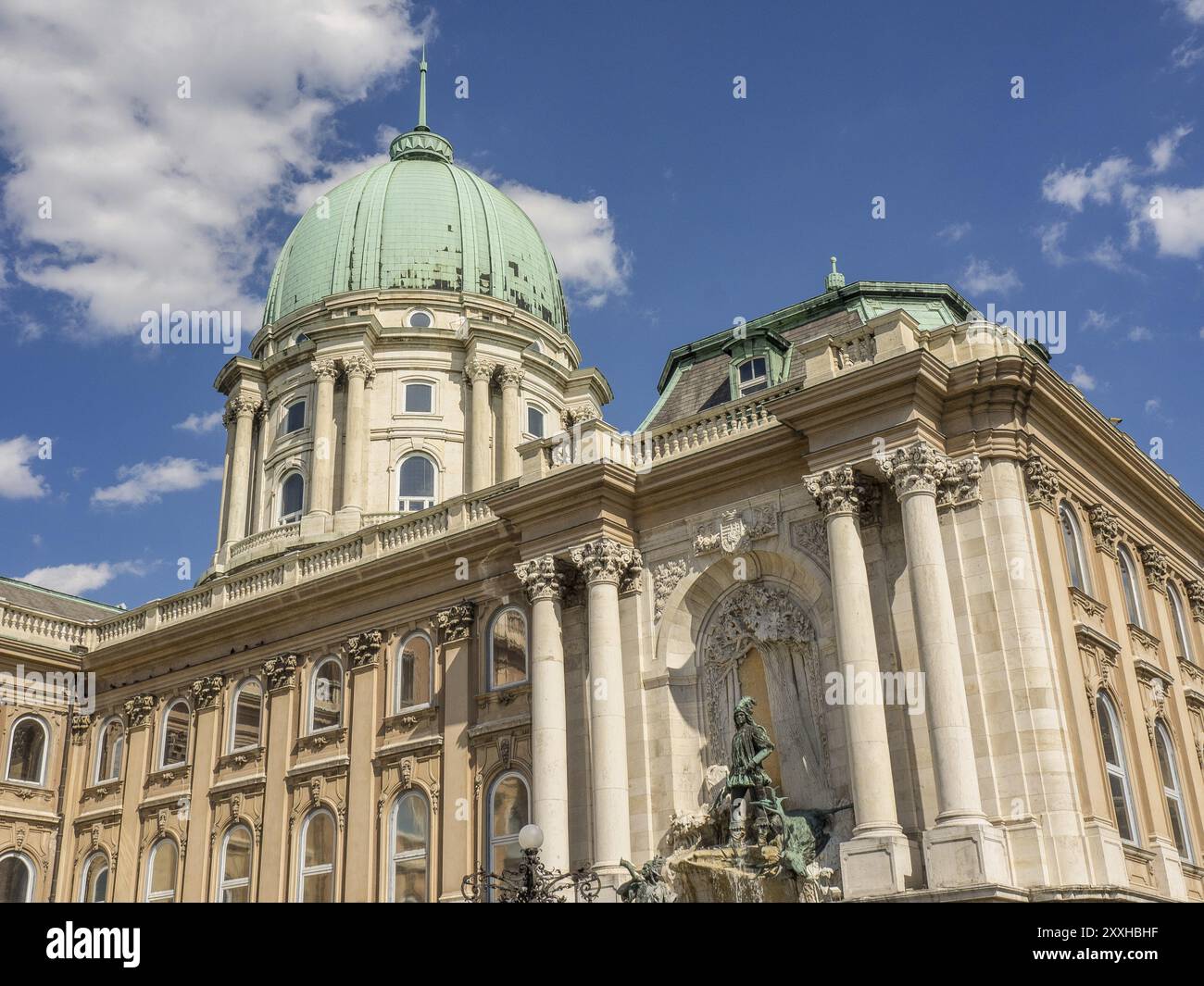 Large historic building with green dome and detailed architecture in ...