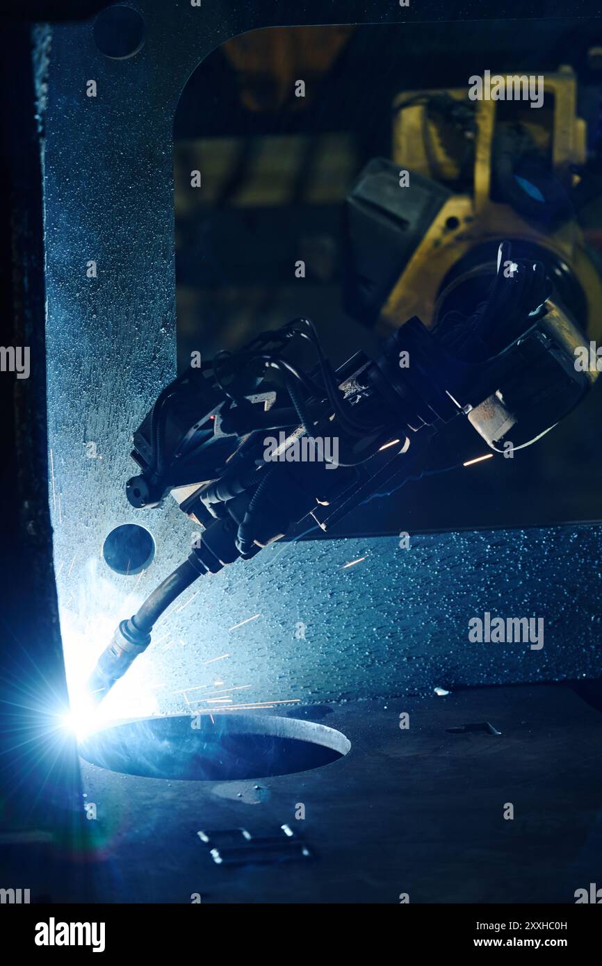 Robotic arm performing complex welding tasks in industrial environment ... Robotic arm performing complex welding tasks in industrial environment ...