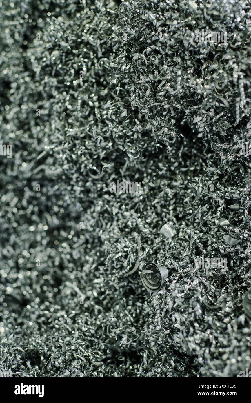 Close-up view of tangled industrial metal shavings and curly strands ...