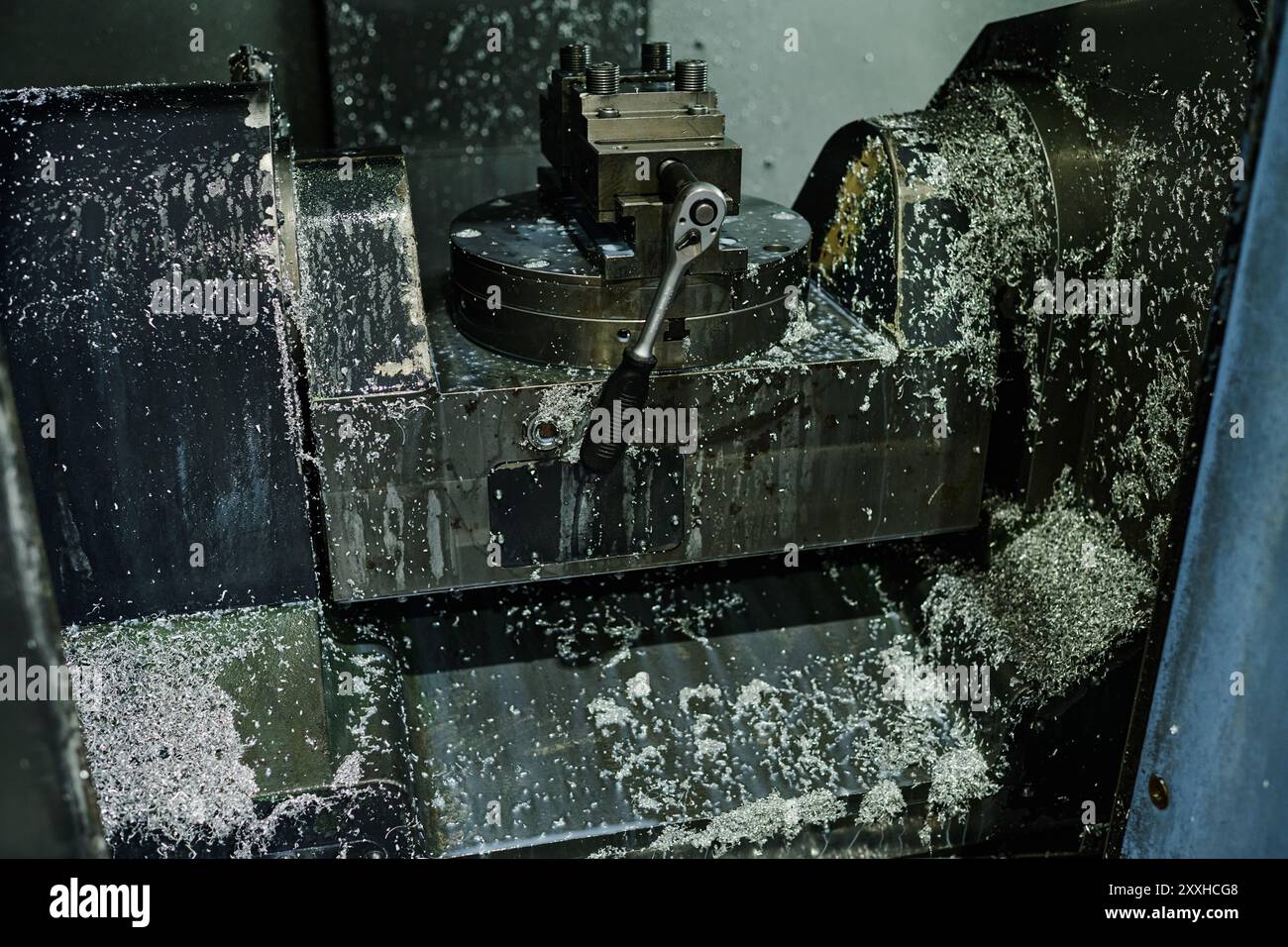 Close-up of CNC milling machine processing metal part, showing ...