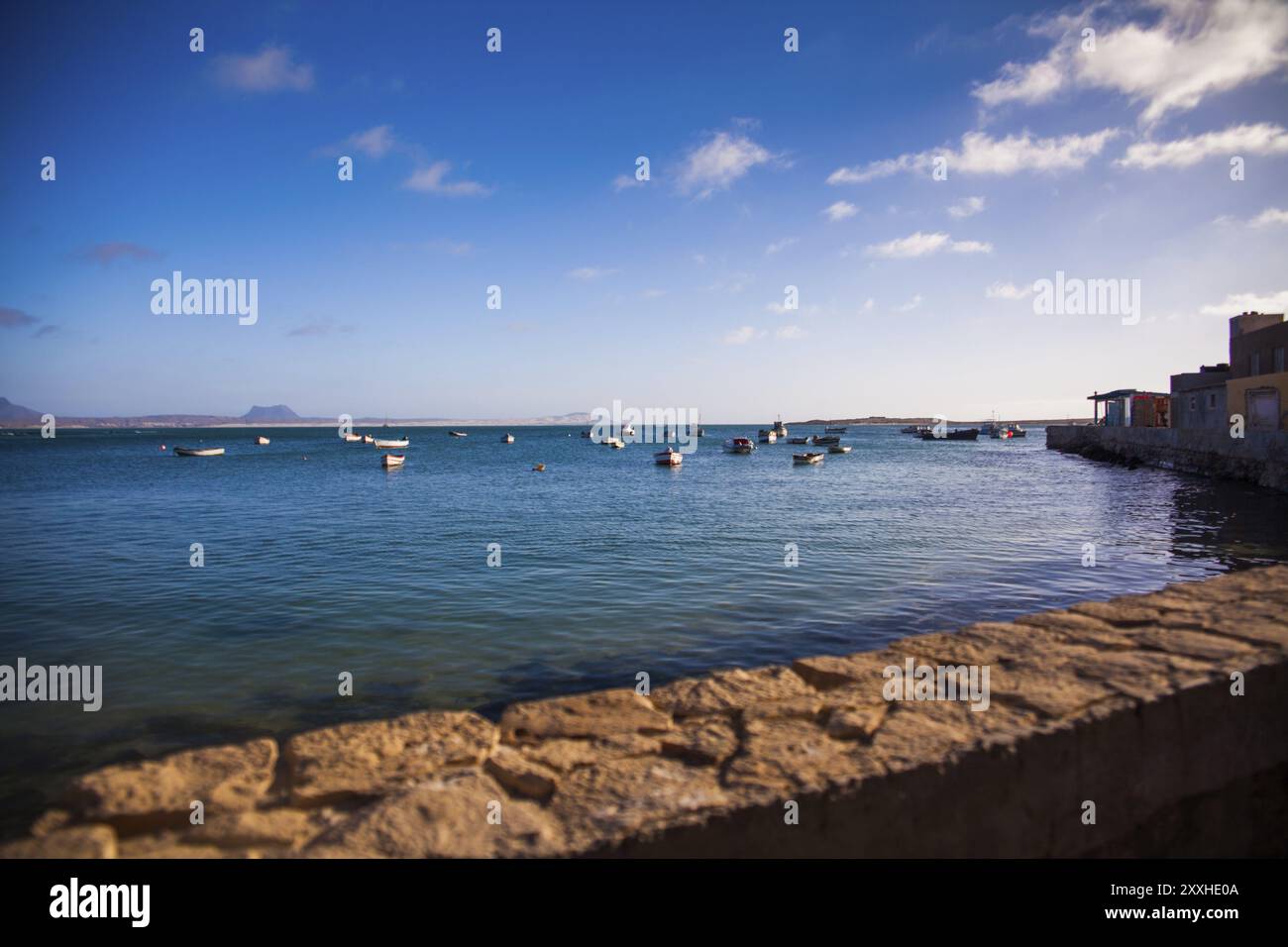 Small boats float in a bay Stock Photo - Alamy