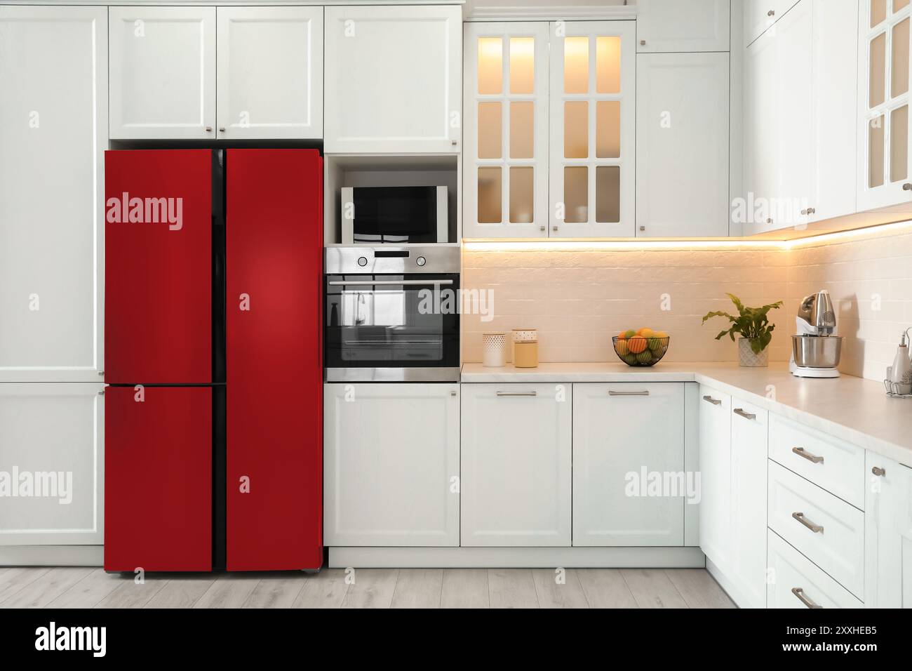 Red refrigerator in kitchen. Bright color accent in interior Stock ...