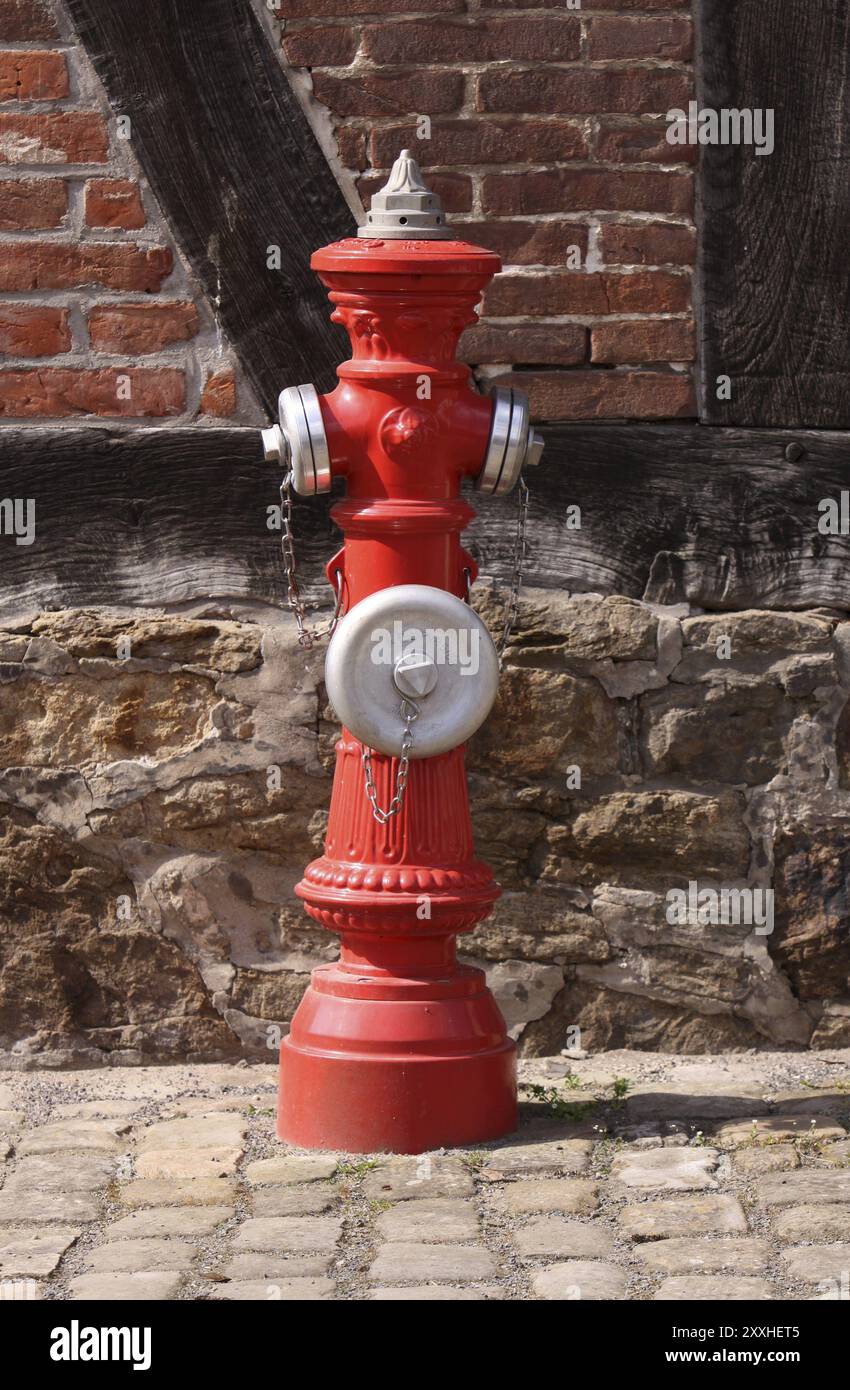 Hydrant in front of a half-timbered house Stock Photo - Alamy