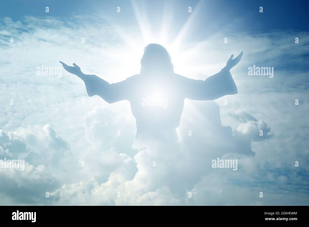 Silhouette of Jesus Christ in sunlight among clouds in sky Stock Photo ...