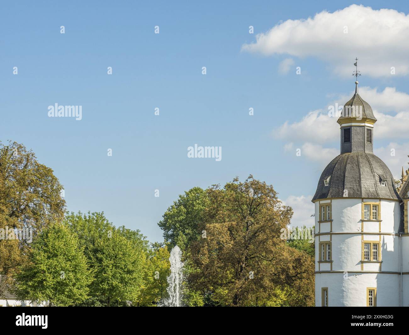 The striking castle tower with surrounding nature and clear sky on a ...